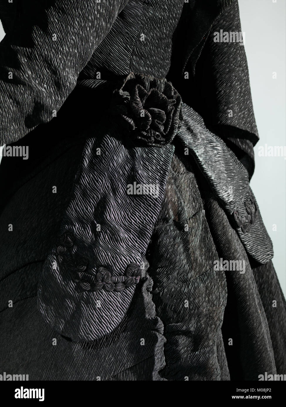 A mourning ensemble of garments and accessories used in funeral rituals ...
