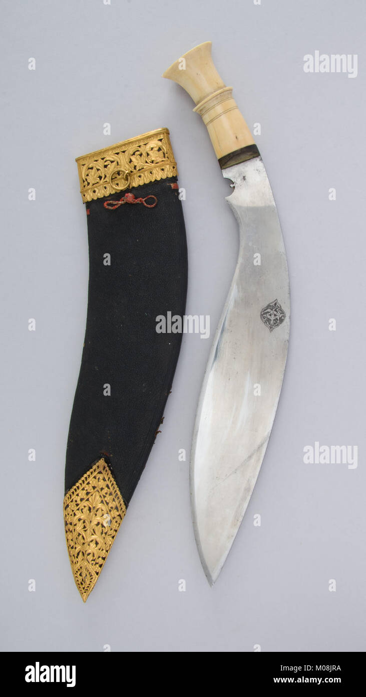 This kukri knife, accompanied by its sheath, is a traditional weapon ...