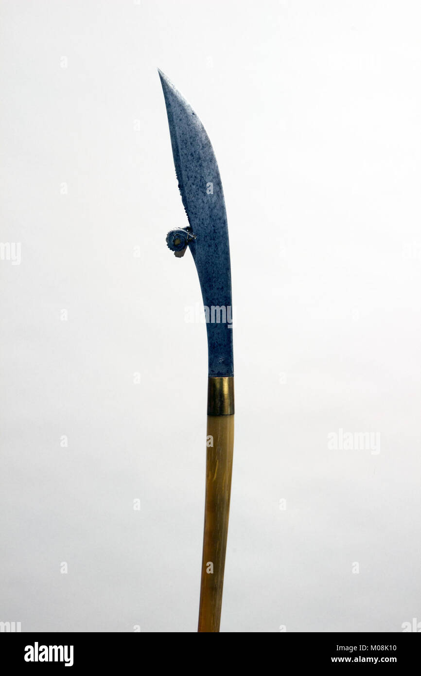 A historically significant knife with a detailed blade and intricate ...