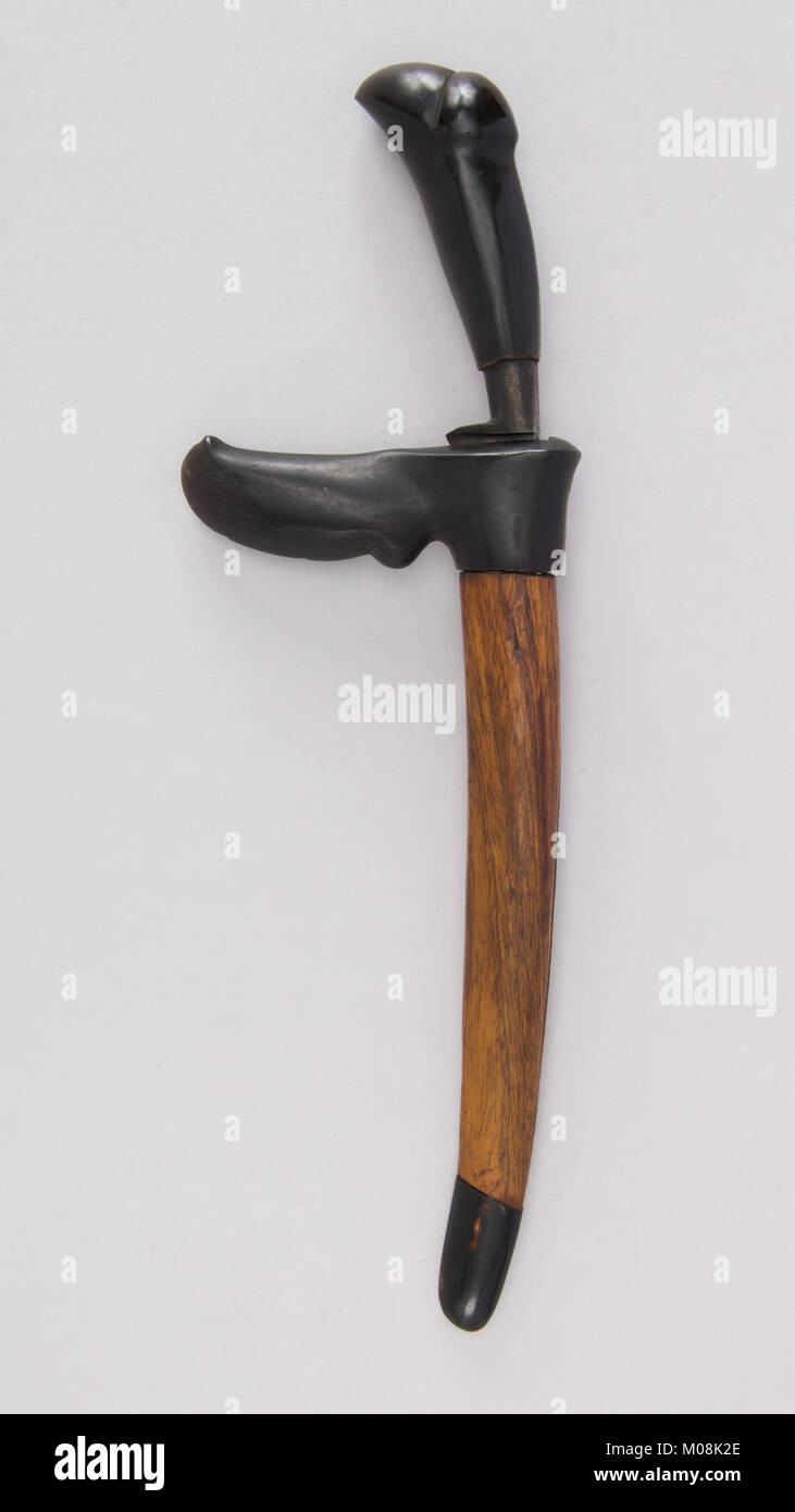 A Bade-bade knife with sheath illustrating intricate craftsmanship. The ...