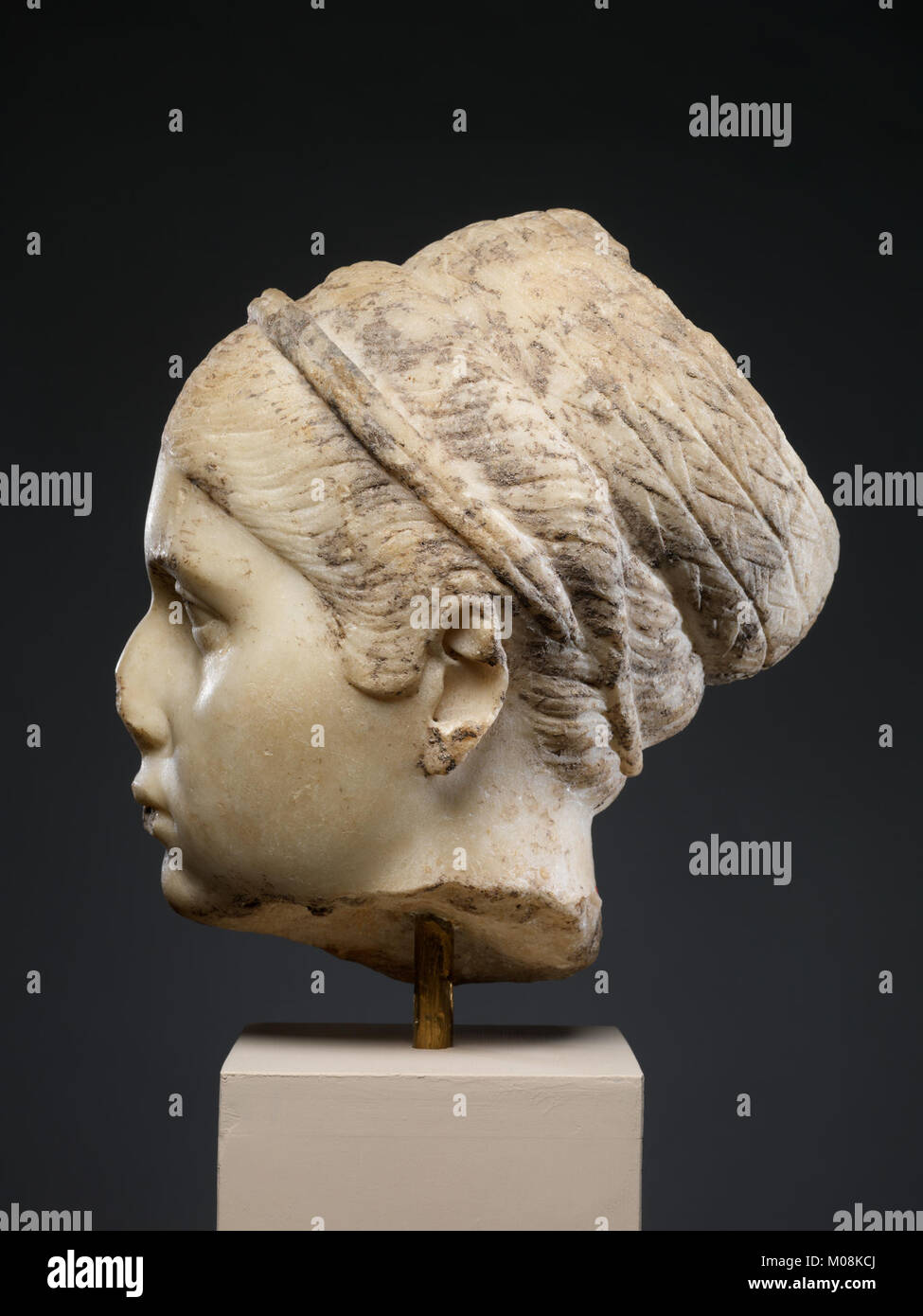 The marble portrait of a young woman displays detailed realism and ...