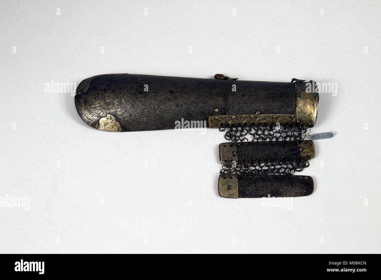 The left arm guard (MET 36.25.396) demonstrates historical armor design ...