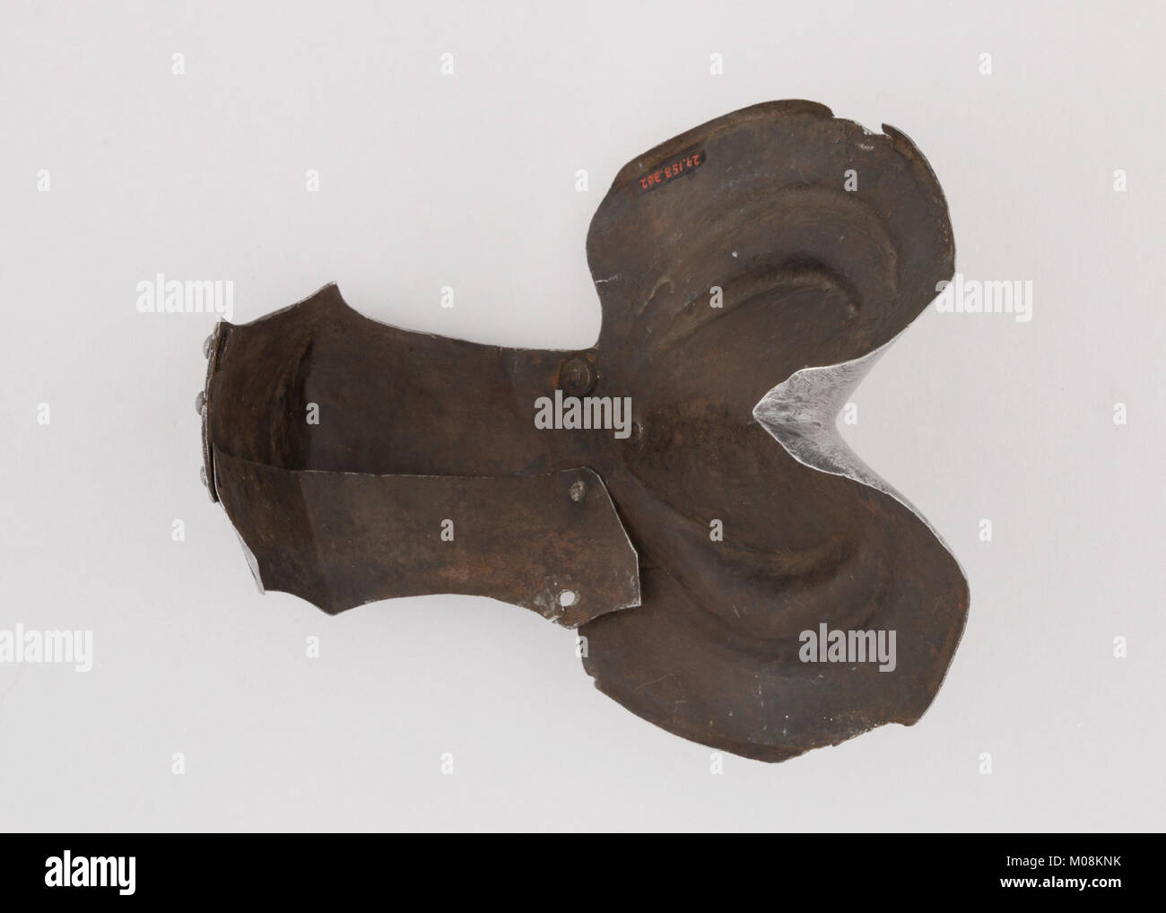 A medieval knee defense (poleyn), part of armor designed for protection ...