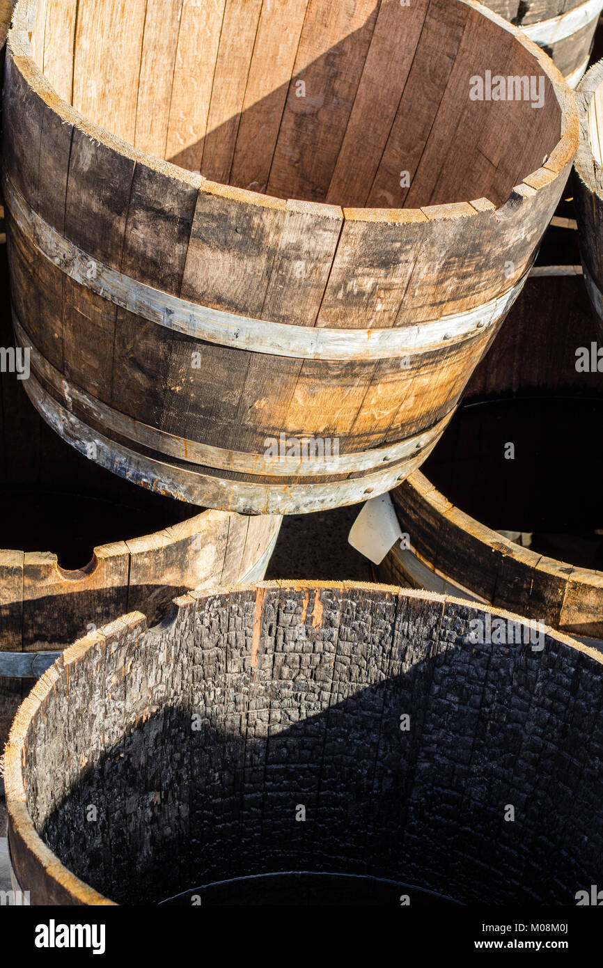 Stacked old wooden half barrels at gerden store is about to have second ...