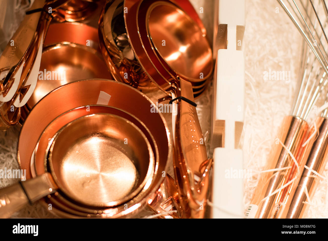Copper measuring cups/spoons in sets of different sizes on display ...