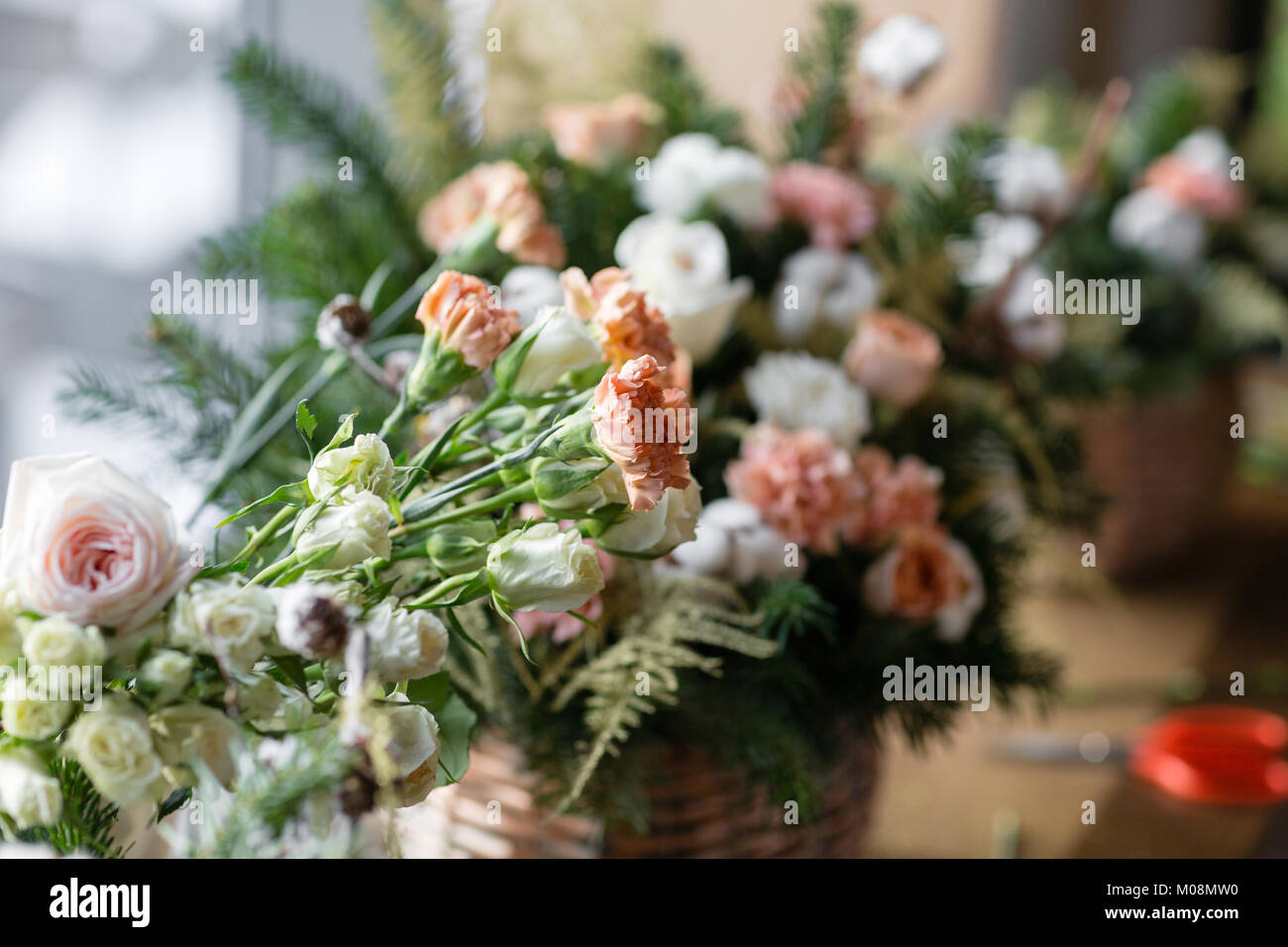 Big bouquet of fresh flowers, peach carnation and white roses in a ...