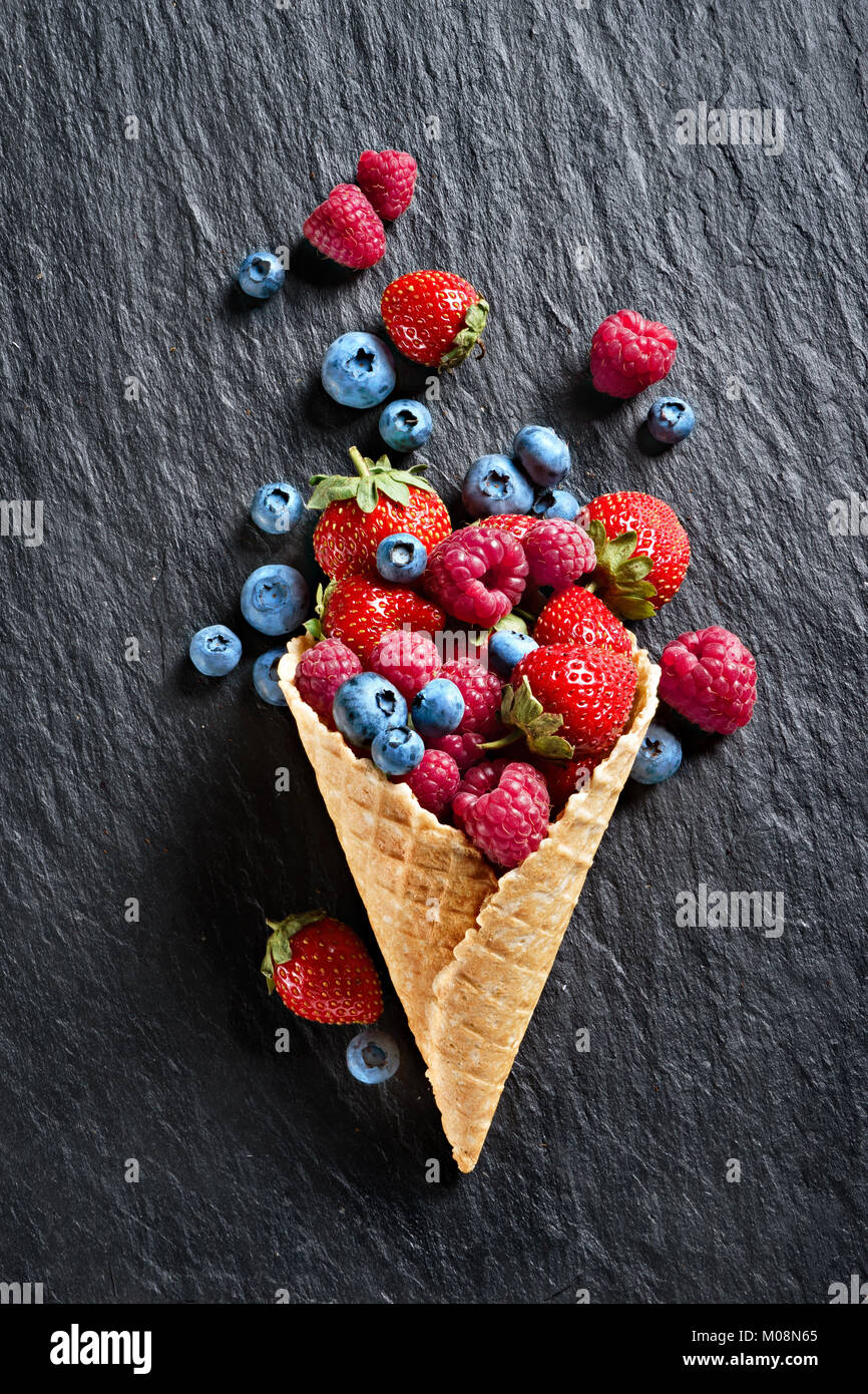 Explosion of different berries. Photo of blueberry, strawberry ...