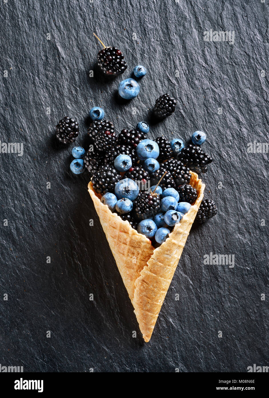 Explosion of different berries. Photo of blueberry and blackberry in ...
