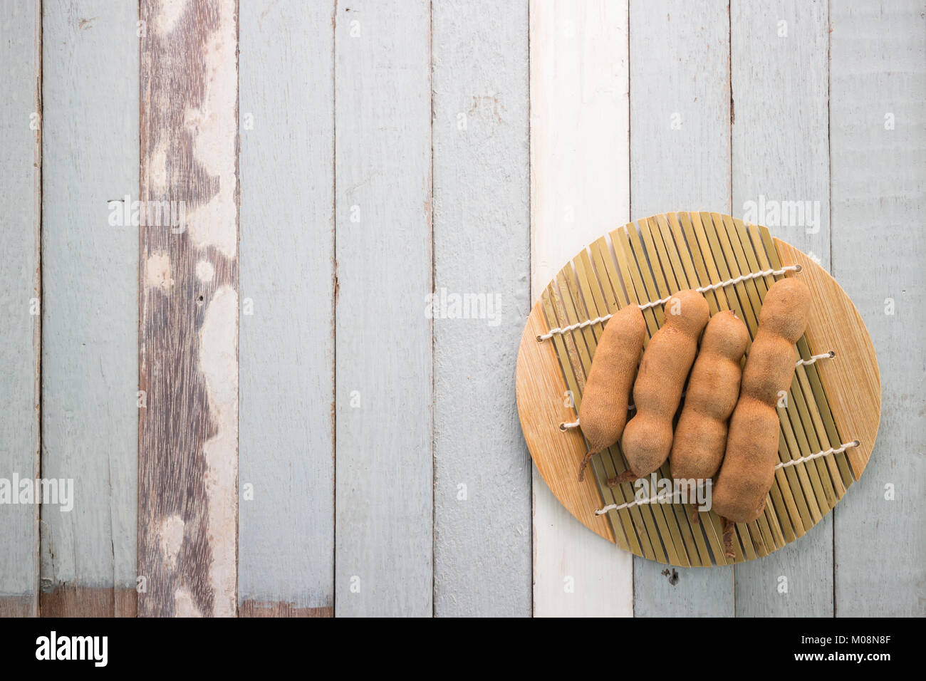 tamarind on wood table Stock Photo - Alamy