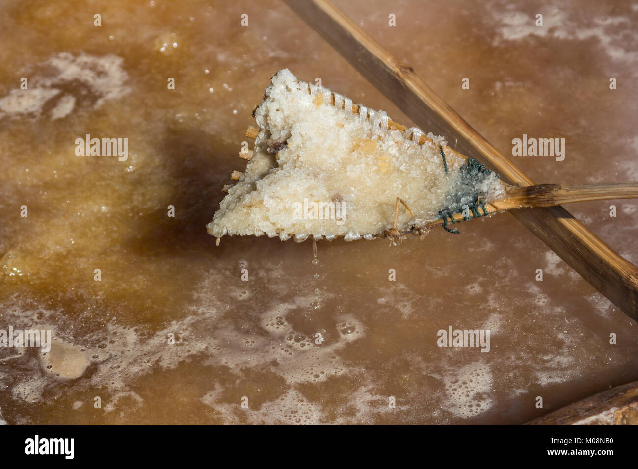 Salt production by boiling in the countryside Stock Photo - Alamy