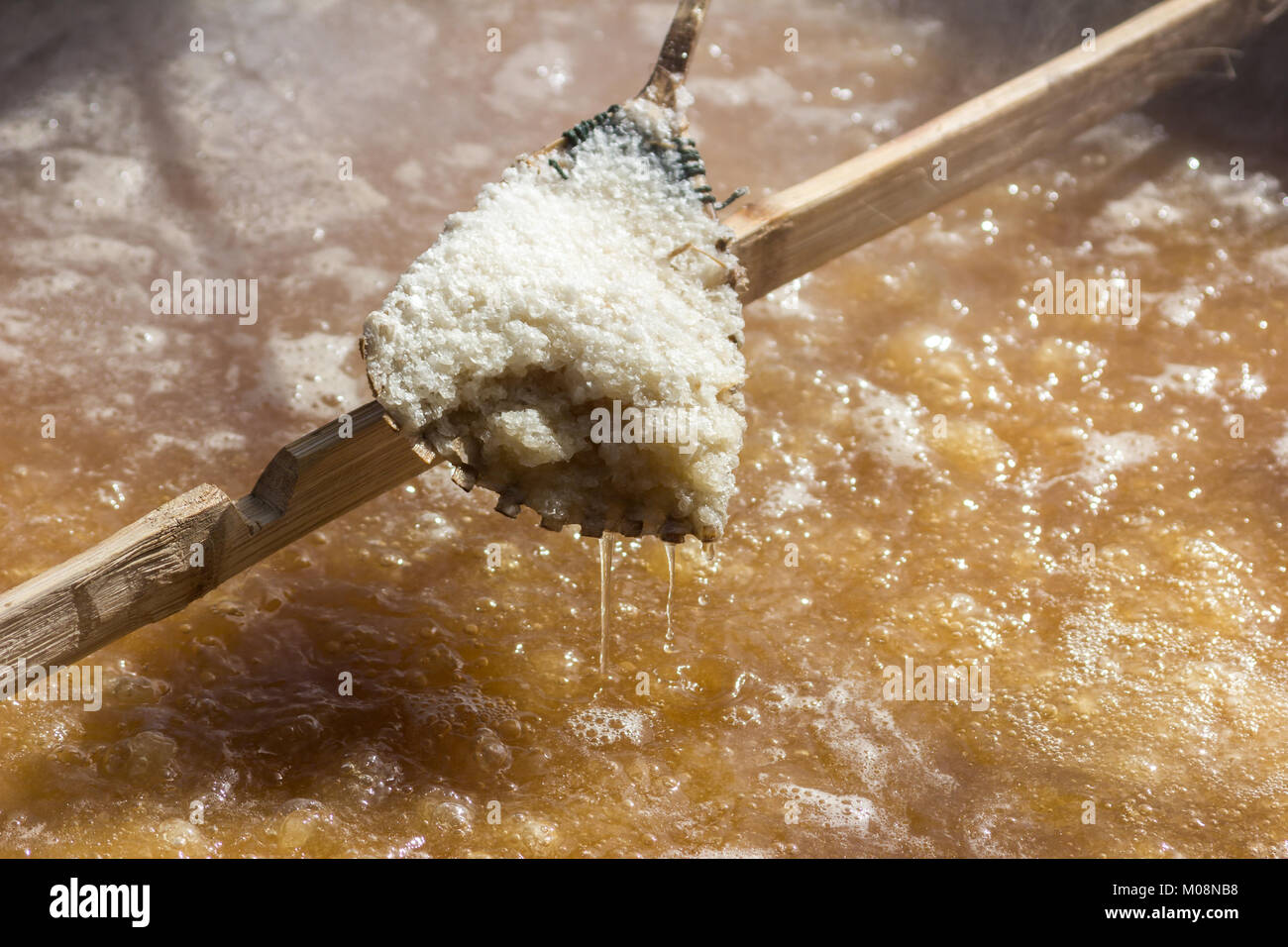 Salt production by boiling in the countryside Stock Photo - Alamy