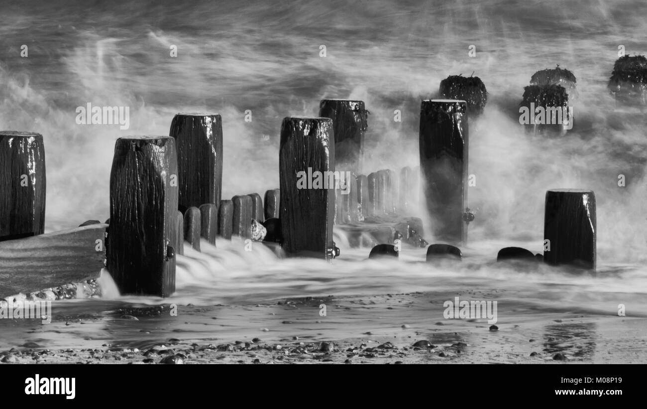 Waves breaking groyne sea Black and White Stock Photos & Images - Alamy