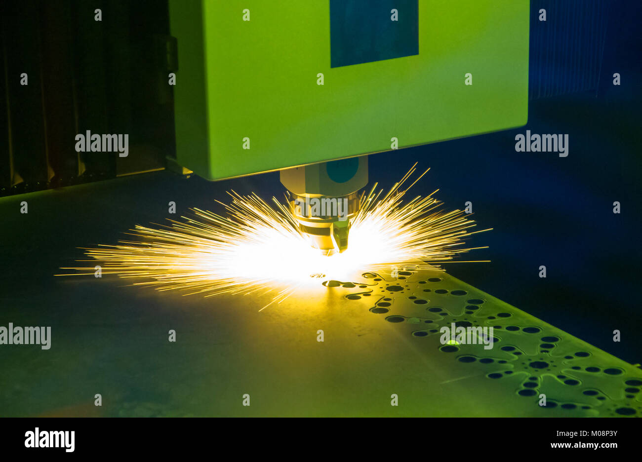 CNC machine laser cutting process metal sheet with sparking Stock Photo ...