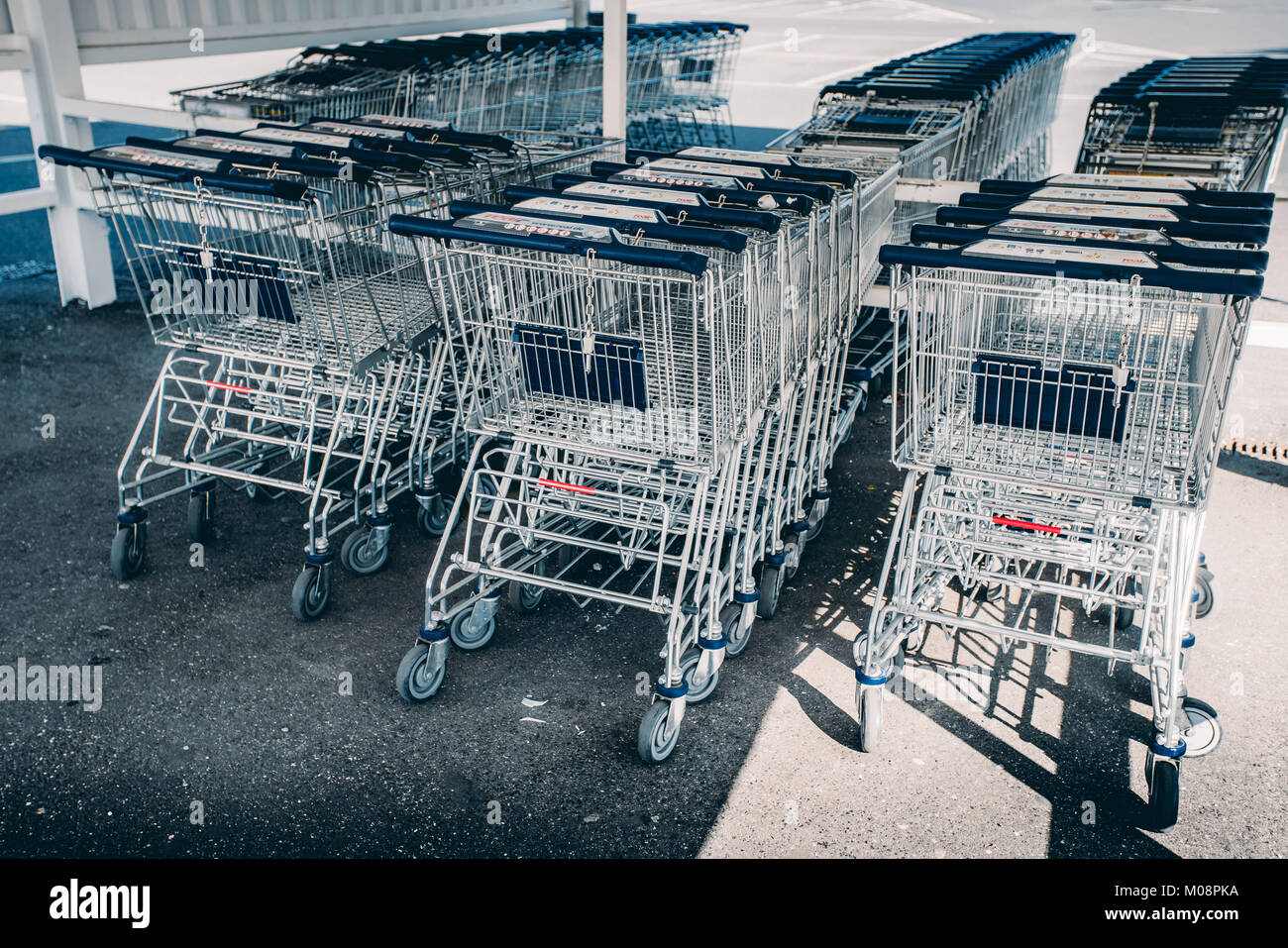 shopping carts. metal shopping carts at the back of a store. shopping ...