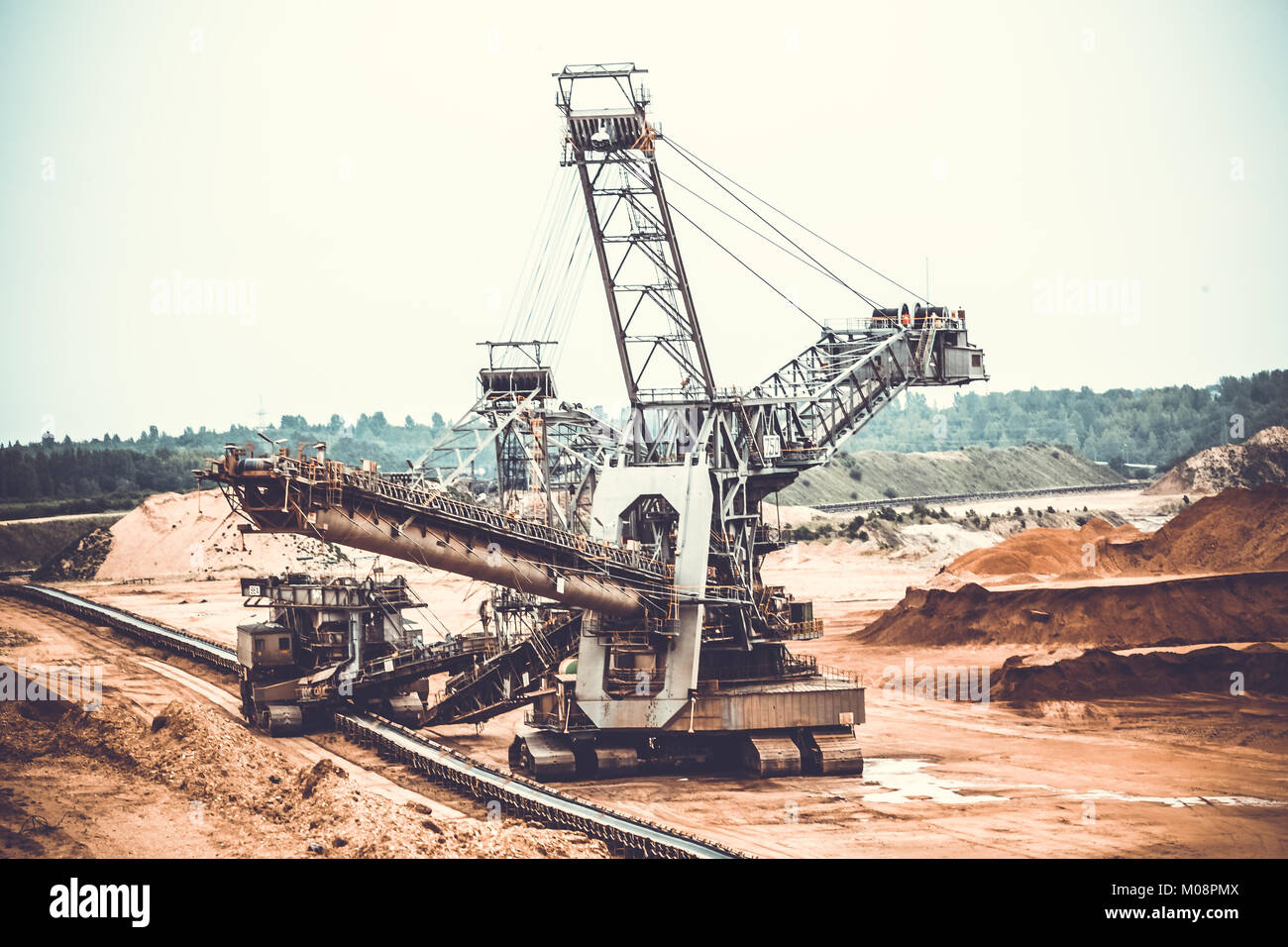 coal mining. Giant wheel of bucket wheel excavator. Long conveyor belt ...