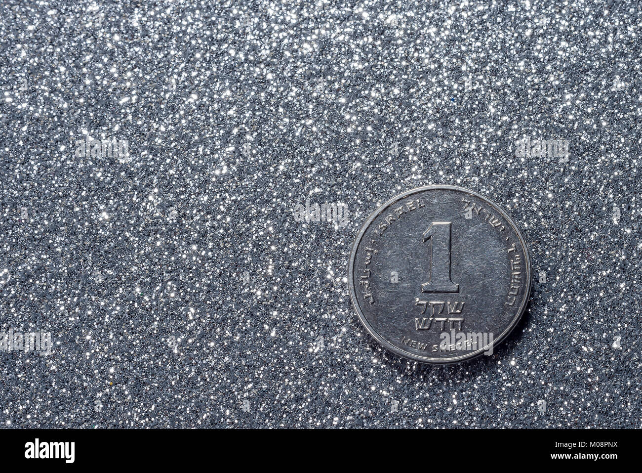 one Israeli New Sheqel. One shekel on a silvery background Stock Photo ...