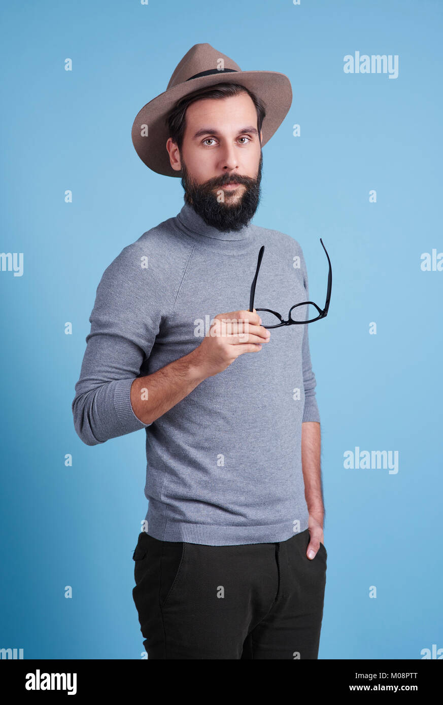 Confident and serious man at studio shot Stock Photo - Alamy