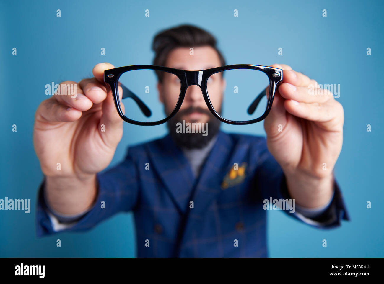 Man Holding Object In Front Of Face High Resolution Stock Photography ...