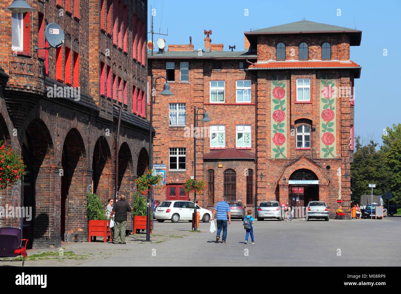 KATOWICE, POLAND - SEPTEMBER 5, 2014: People visit Nikiszowiec historic ...