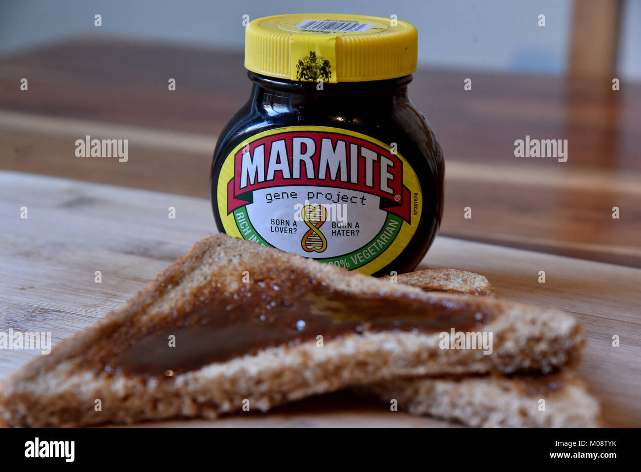 A jar of Marmite with brown bread toast Stock Photo - Alamy