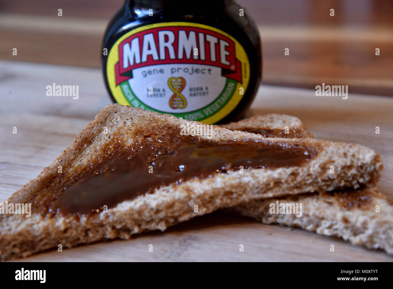A jar of Marmite with brown bread toast Stock Photo - Alamy