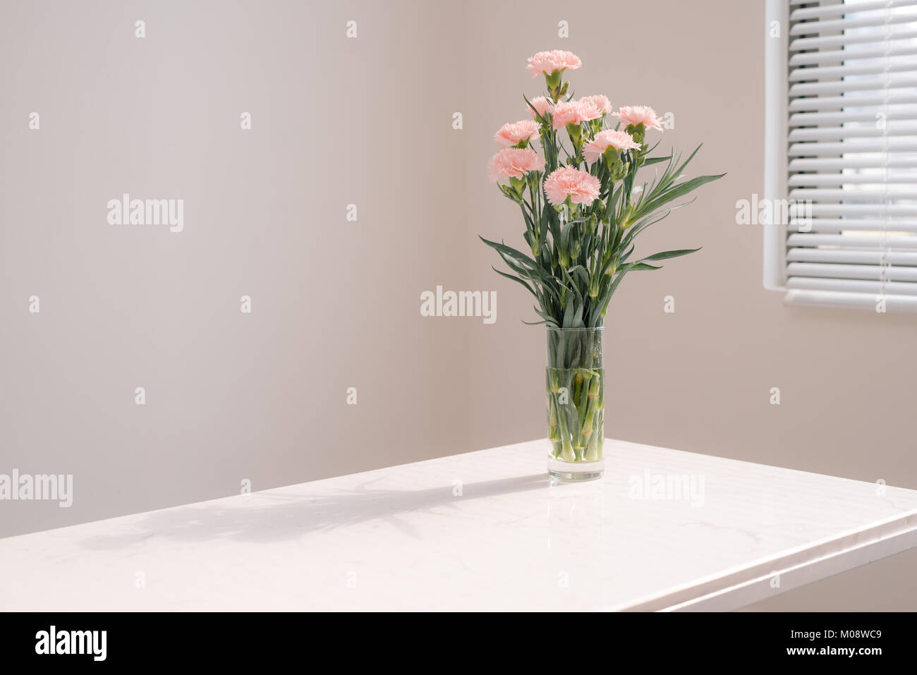 Beautiful spring flowers in vase on window background Stock Photo - Alamy