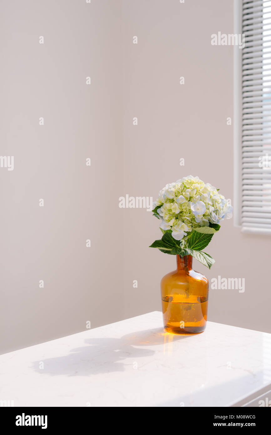 Beautiful spring flowers in vase on window background Stock Photo - Alamy