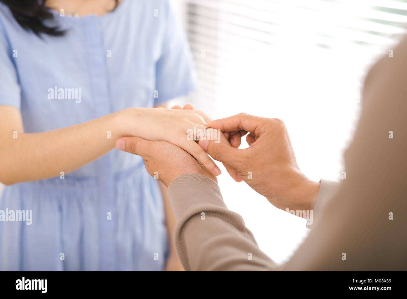 Hand couple put hi-res stock photography and images - Alamy