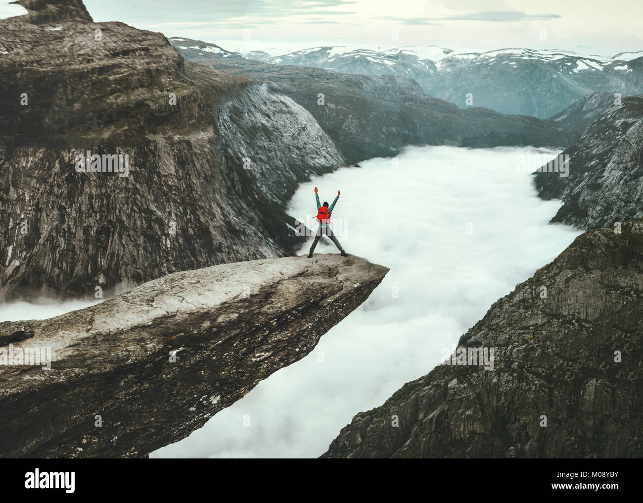 Man jumping on edge cliff hi-res stock photography and images - Alamy