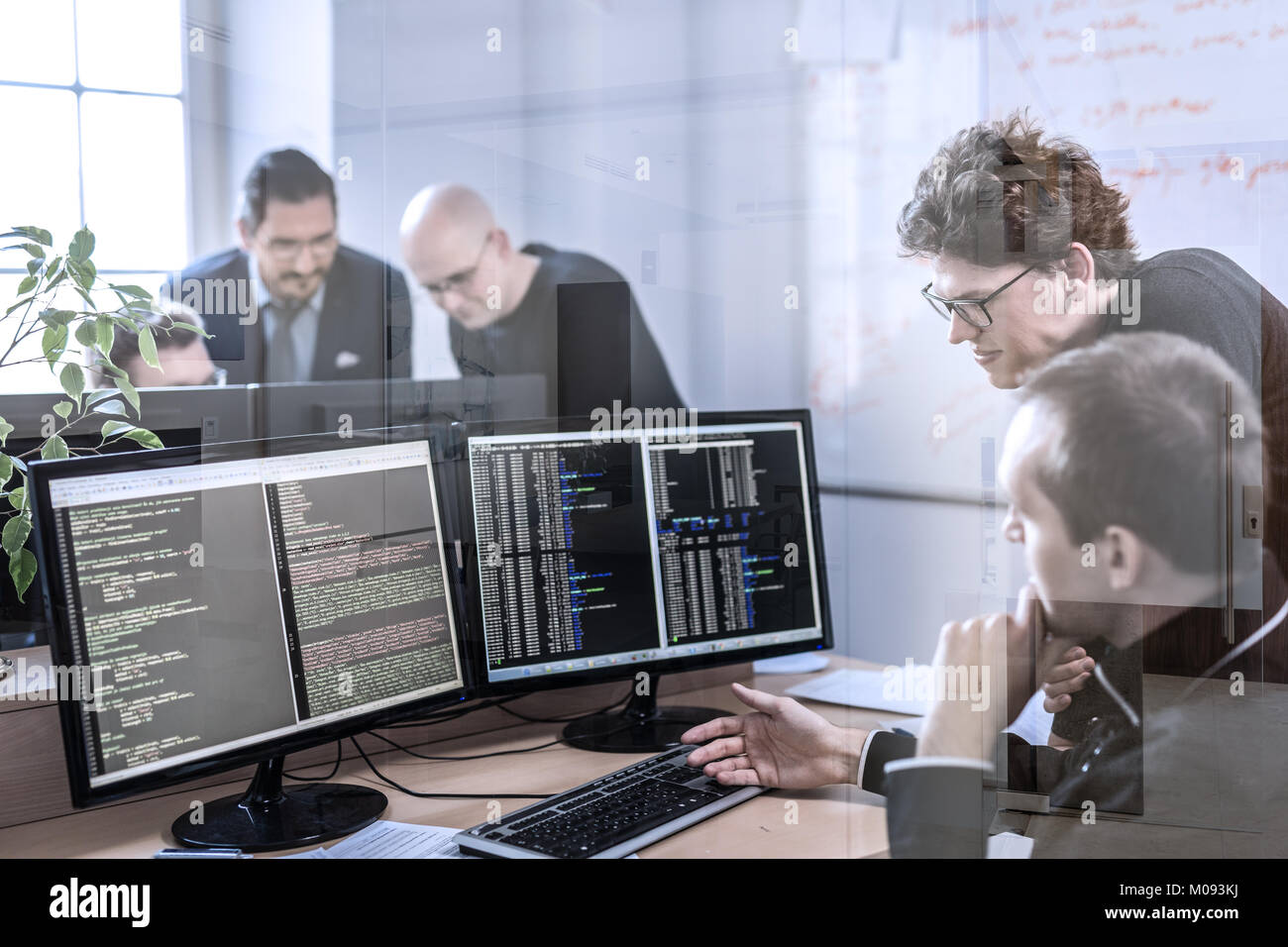 Startup business problem solving. Software developers working on ...