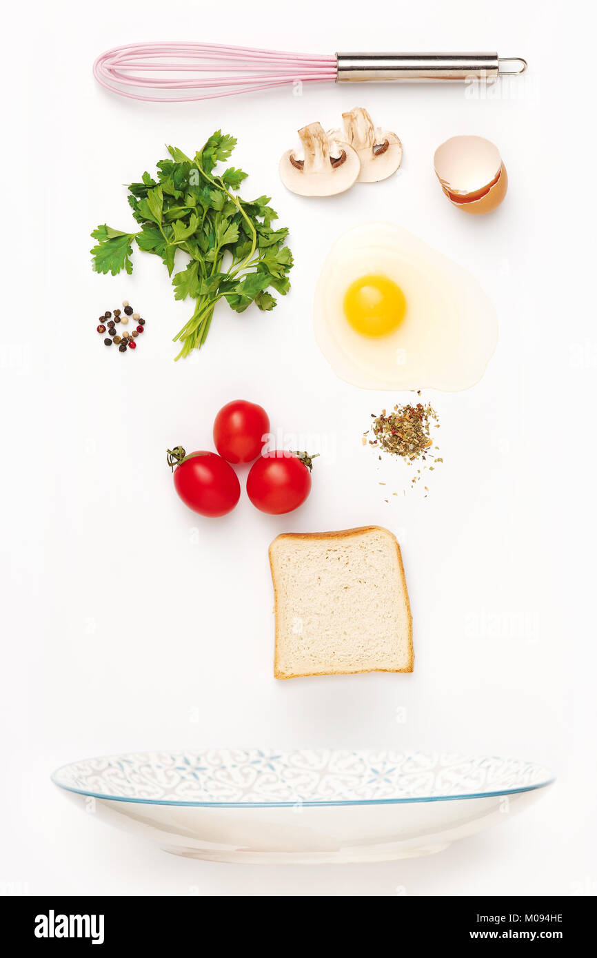 The falling ingredients of fried egg. Healthy breakfast ingredients ...