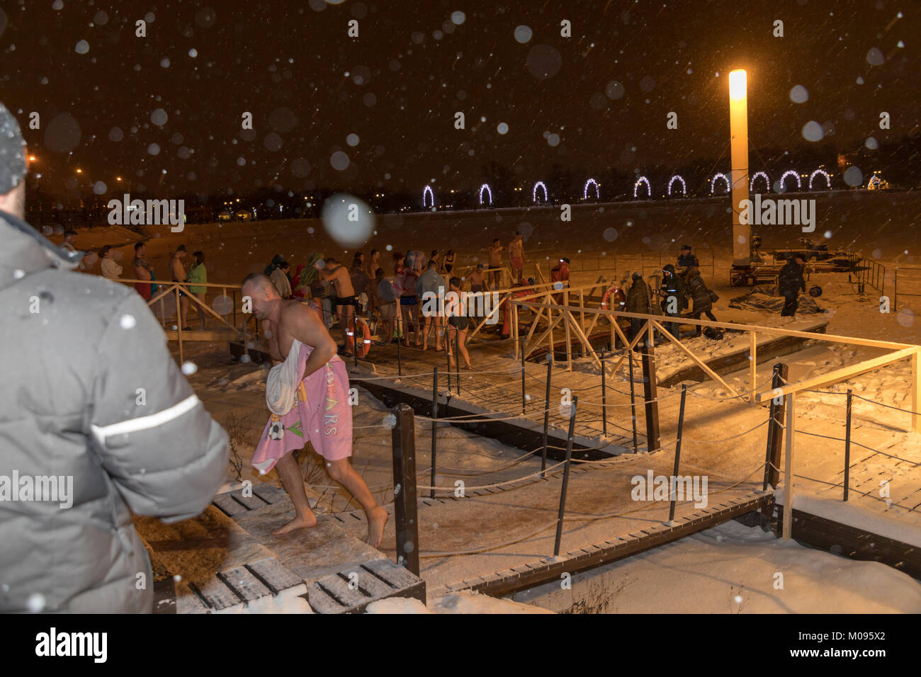 Bathing in the ice hole at Epiphany Stock Photo - Alamy