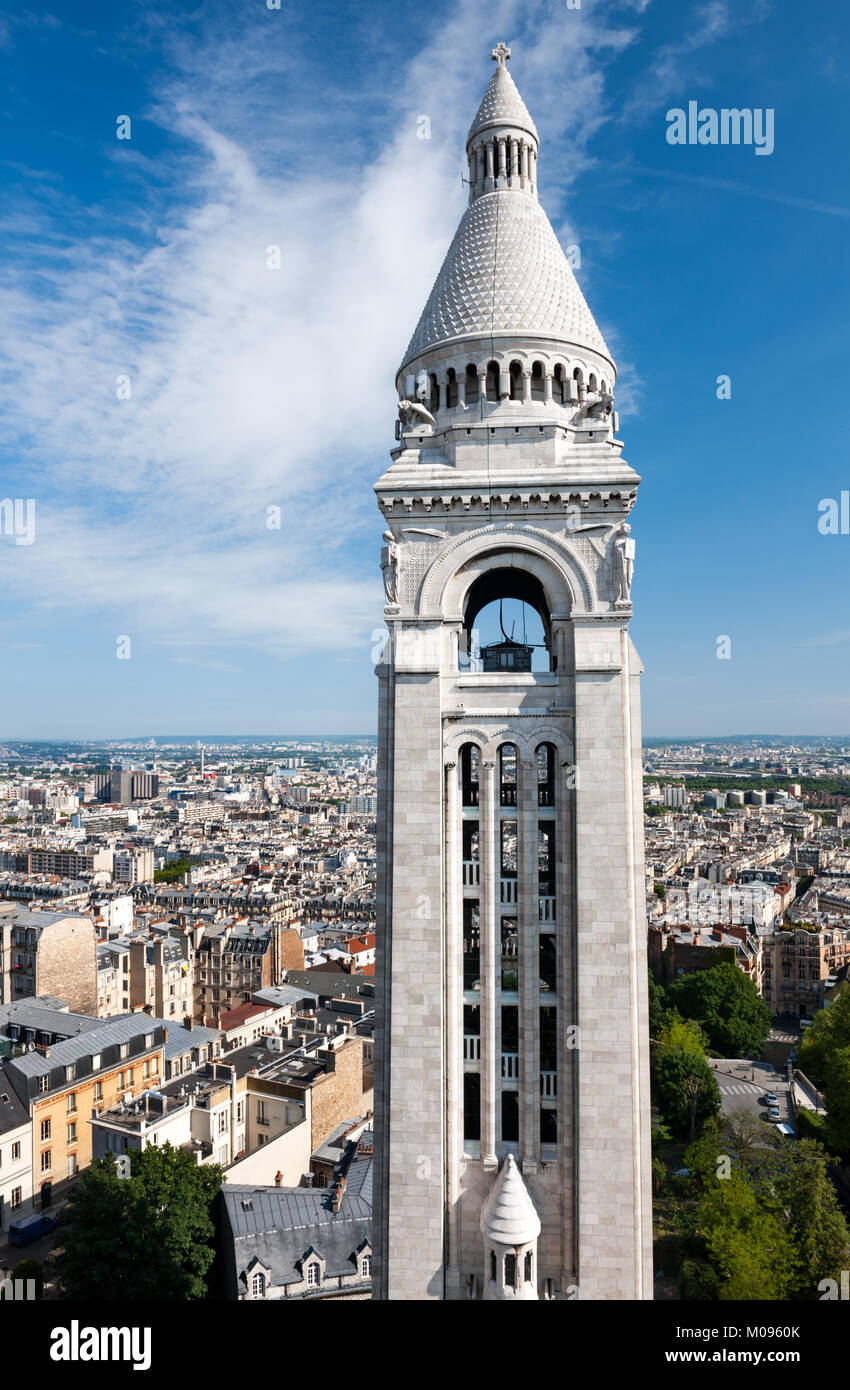Bell tower of the Sacre Coeur Cathedral with Paris on the backdrop ...