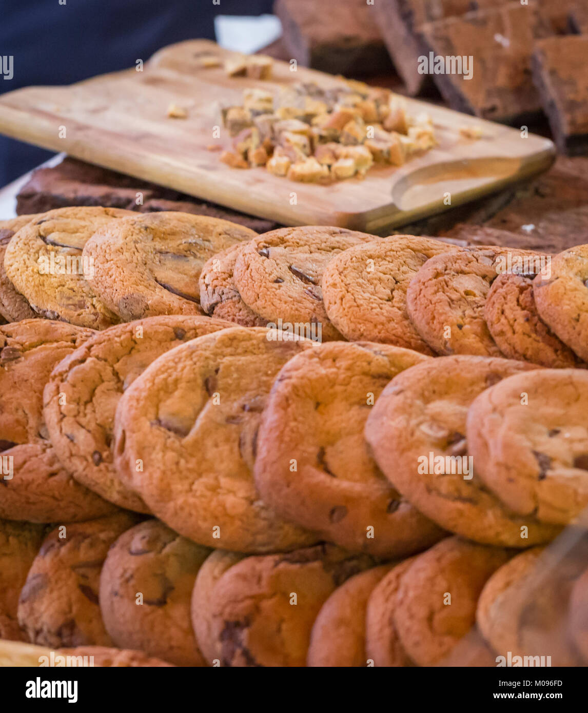 Artisan Chocolate Chip Cookies on display on a market stall in Borough ...