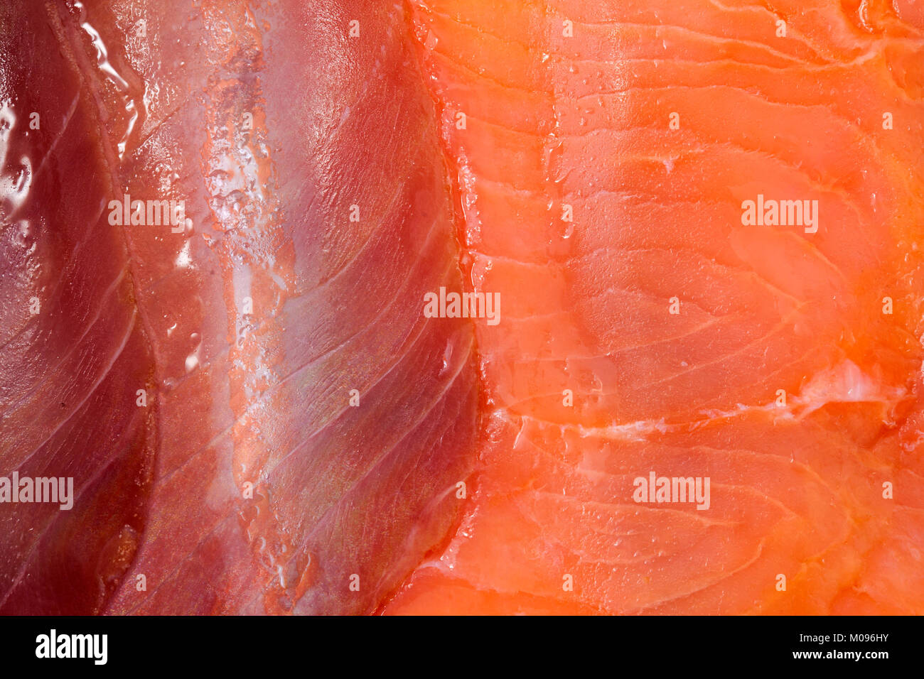 slices of fatty smoked fish deli food bacground Stock Photo - Alamy
