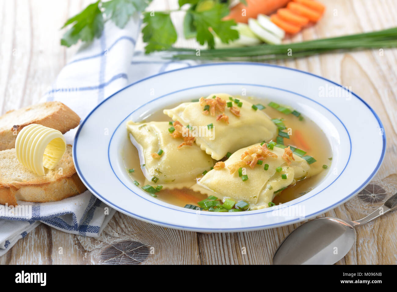 Vegetable broth with Swabian-style stuffed ravioli (so called ...