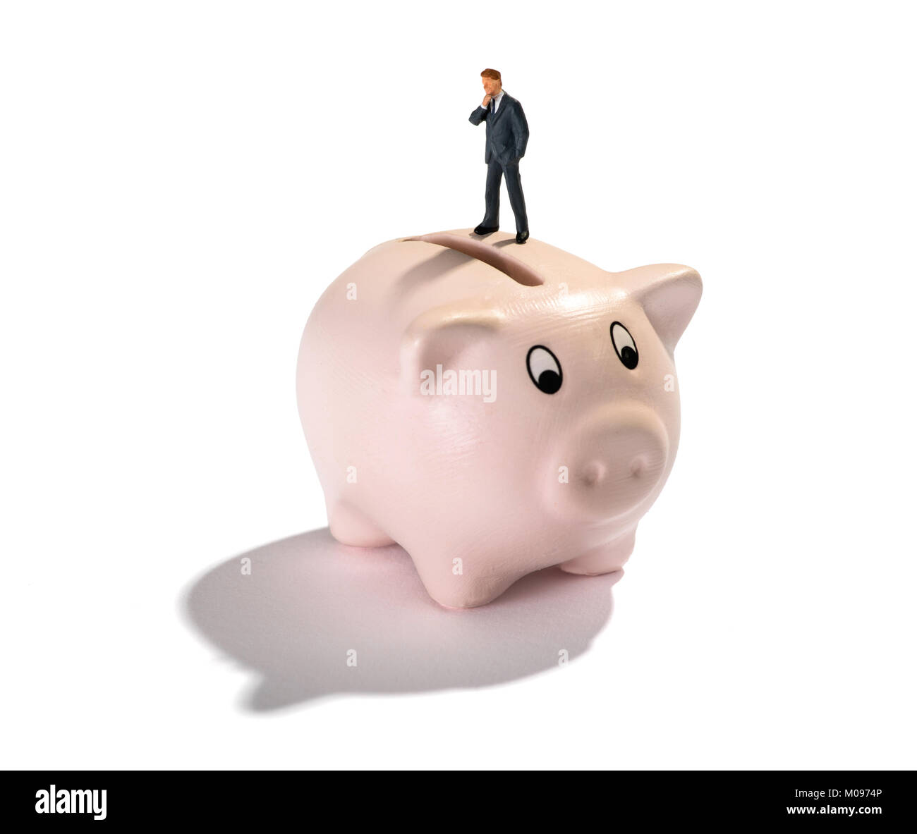 Studio shot close-up of a miniature figure man thinking of savings and ...