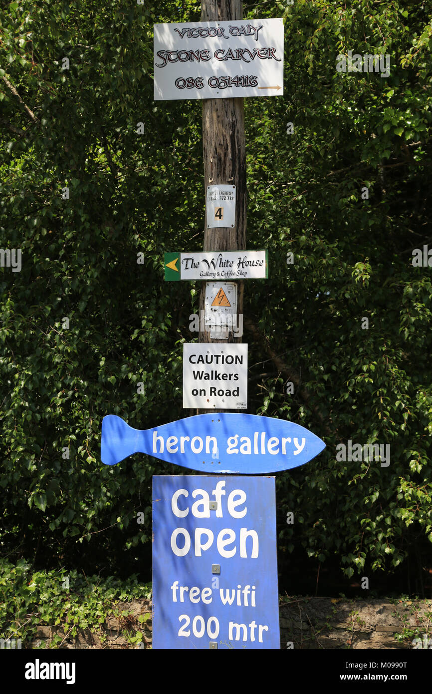 collection of roadsigns on an irish country road, wild atlantic way ...