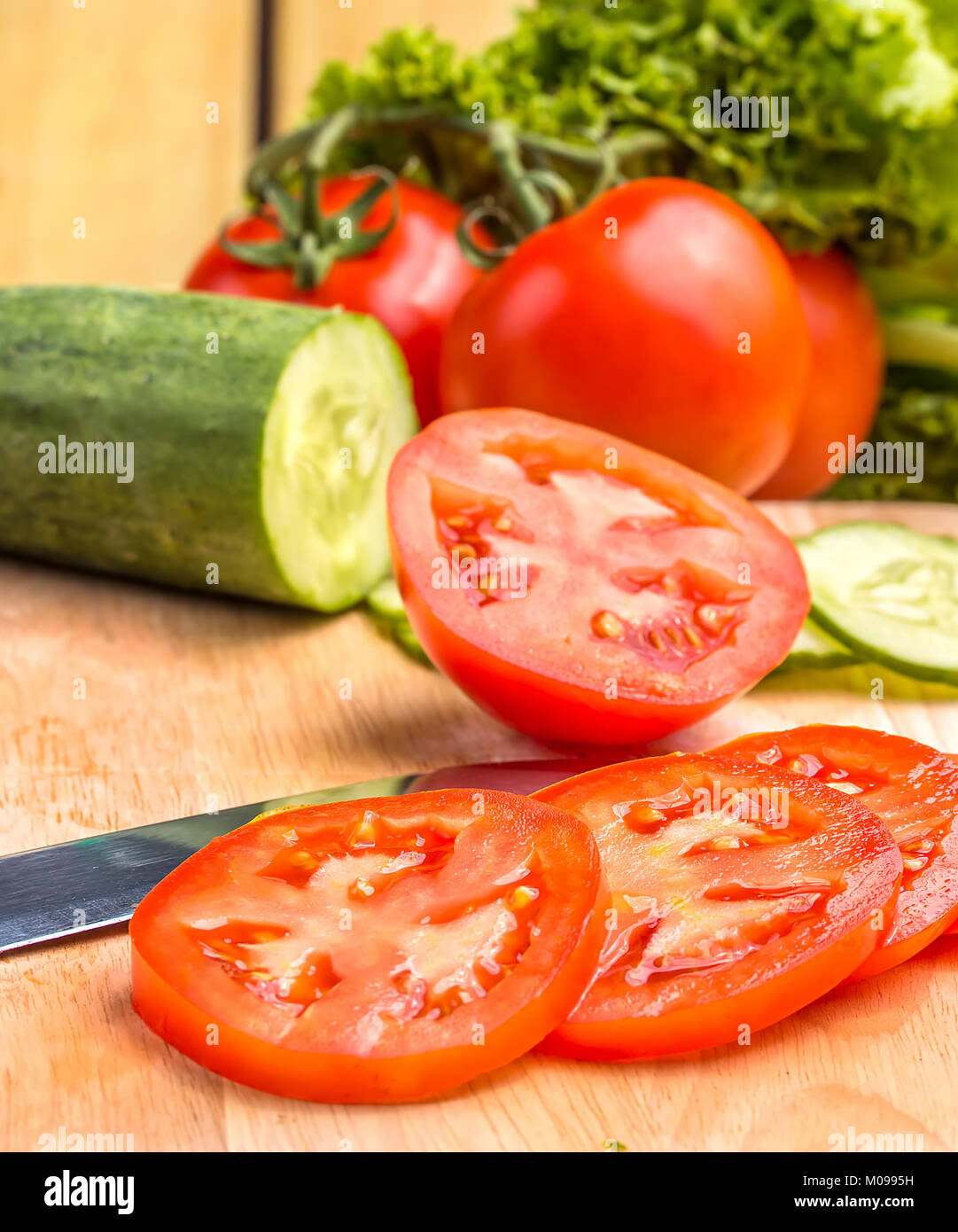 Slicing Tomato Representing Salad Fresh And Delicious Stock Photo - Alamy