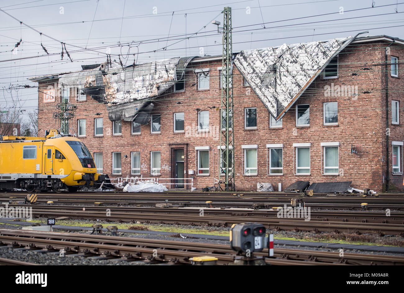 Employees of the German Railways (DB) repair a damaged train station ...