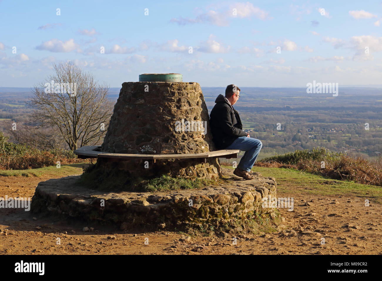 Holmbury Hill, Surrey, UK. 19th Jan, 2018. A man enjoys the sunshine at ...