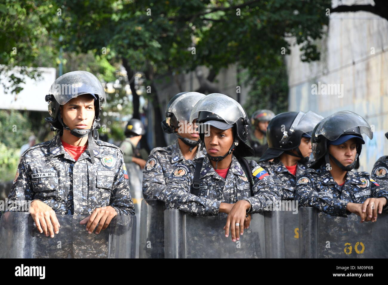 Caracas, Venezuela. 19th Jan, 2018. Police officer seen trying to ...