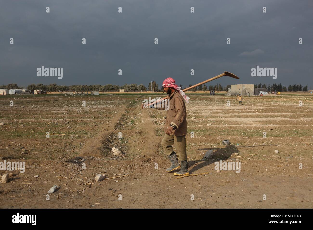 January 18, 2018 - Ash'Ari, Syria - A farmer seen walking while heading ...