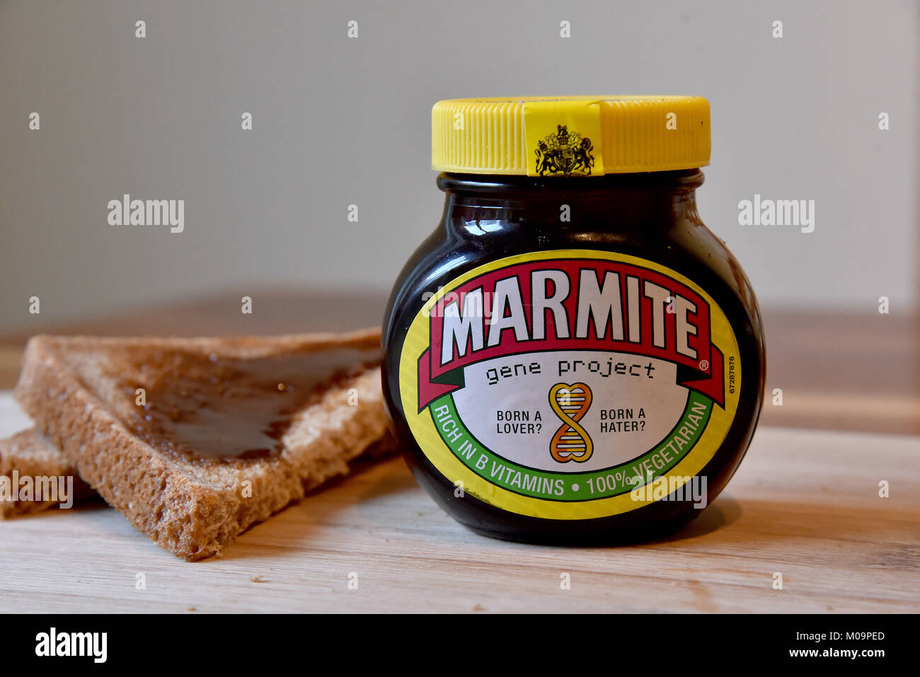 A jar of Marmite with brown bread toast Stock Photo - Alamy