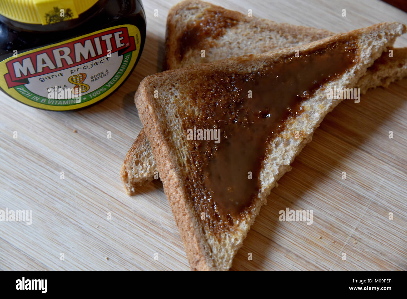 A jar of Marmite with brown bread toast Stock Photo - Alamy
