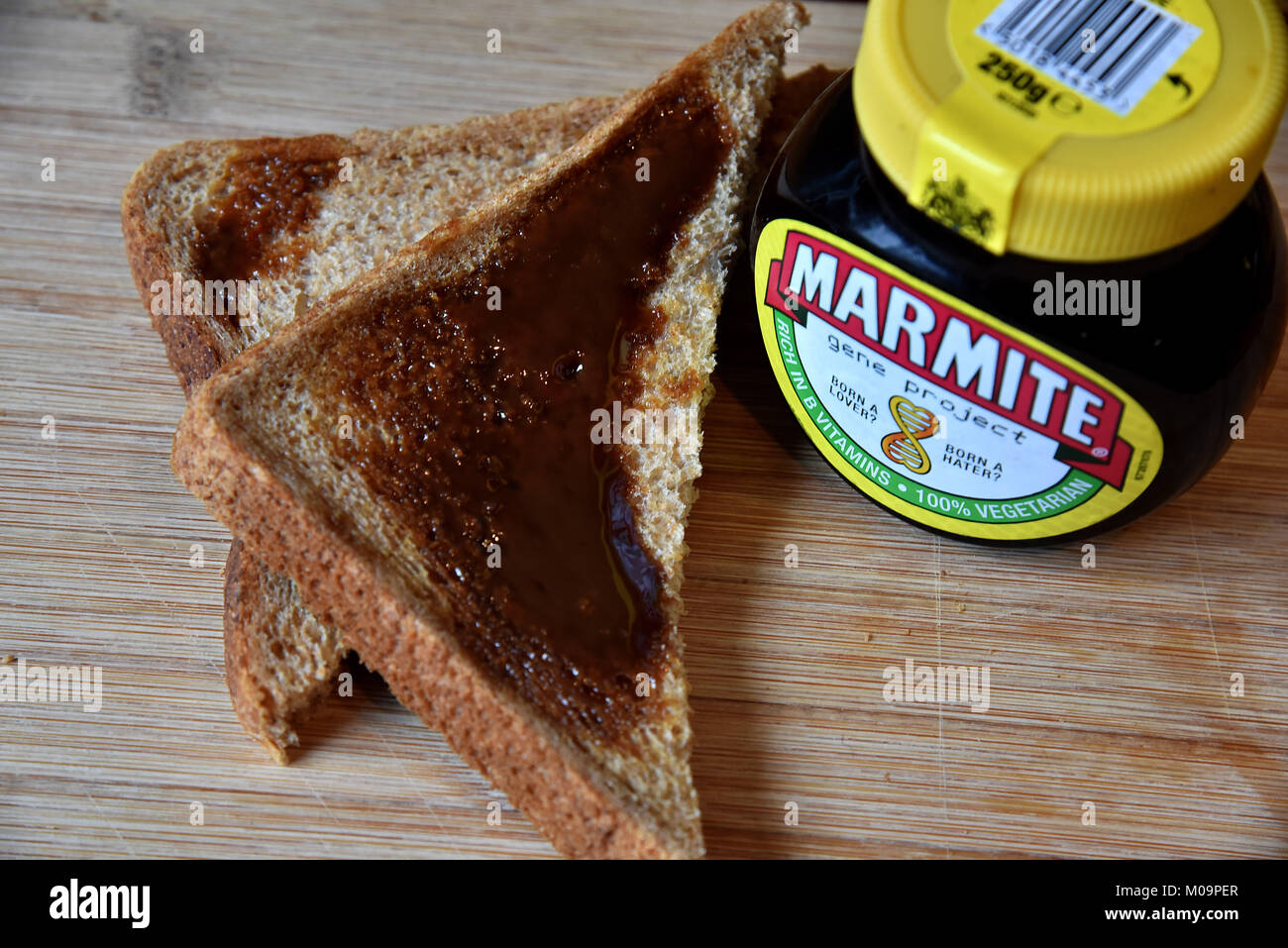 A jar of Marmite with brown bread toast Stock Photo - Alamy