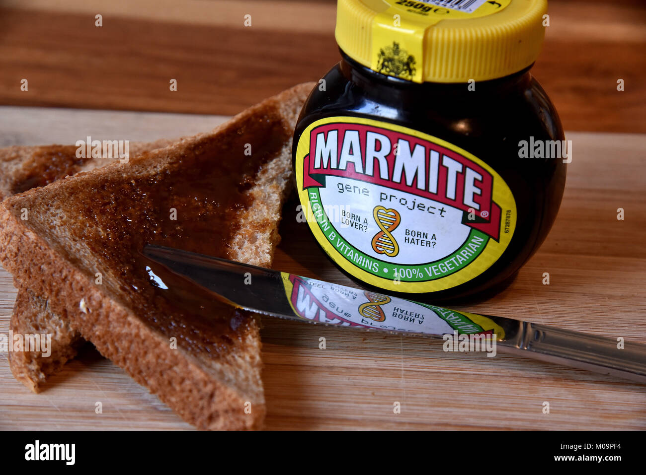 A jar of Marmite with brown bread toast Stock Photo - Alamy