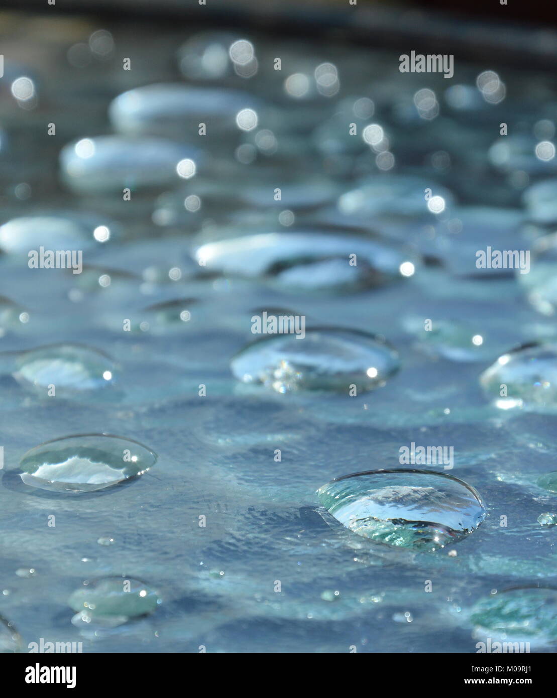 drop of water on glass table Stock Photo - Alamy