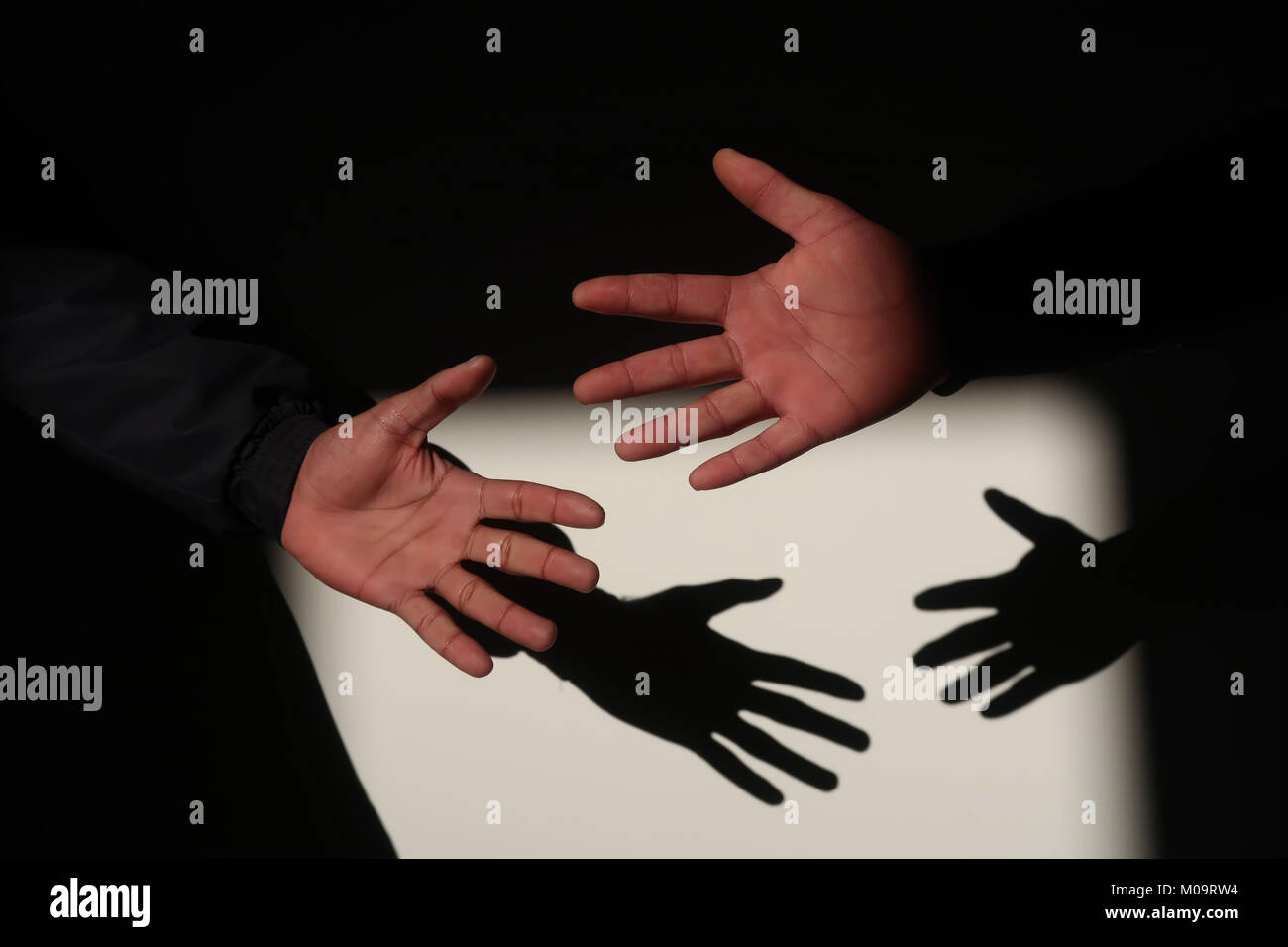 Secret meeting shadow hi-res stock photography and images - Alamy