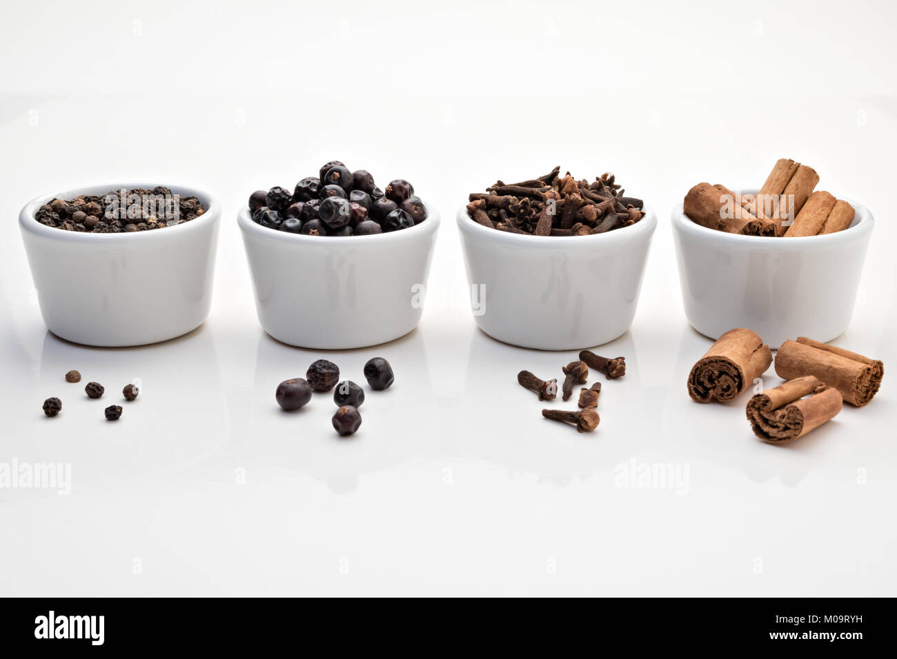 spices black pepper juniper cloves cinnamon in front slats Stock Photo ...